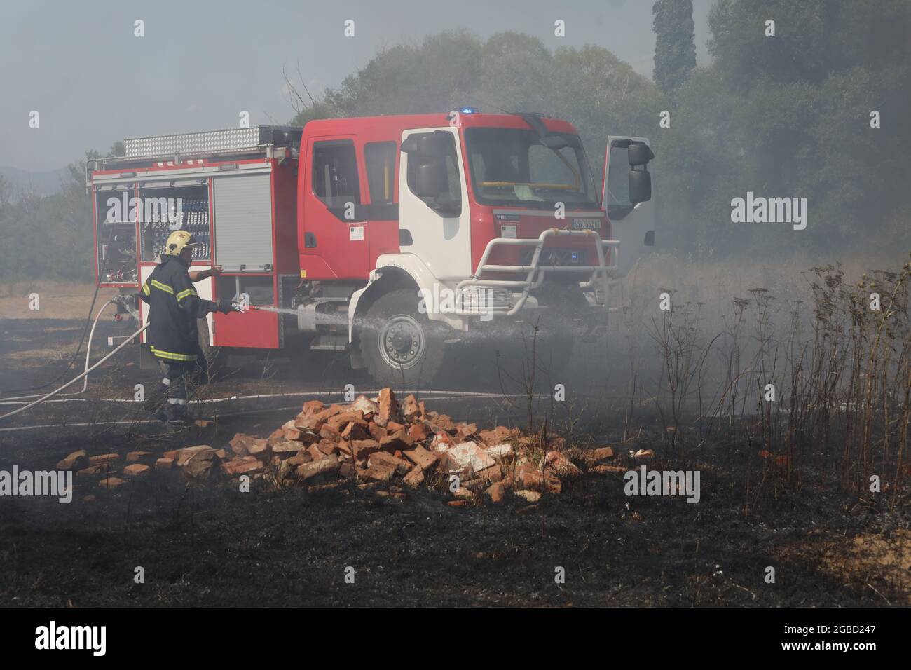 Sofia, Bulgaria - August 3, 2021: A team of firefighters extinguished a ...