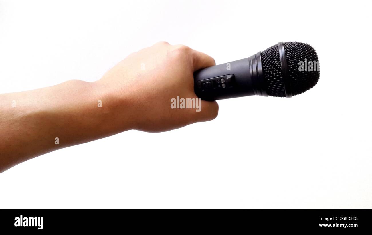 Microphone on hand isolated Stock Photo - Alamy