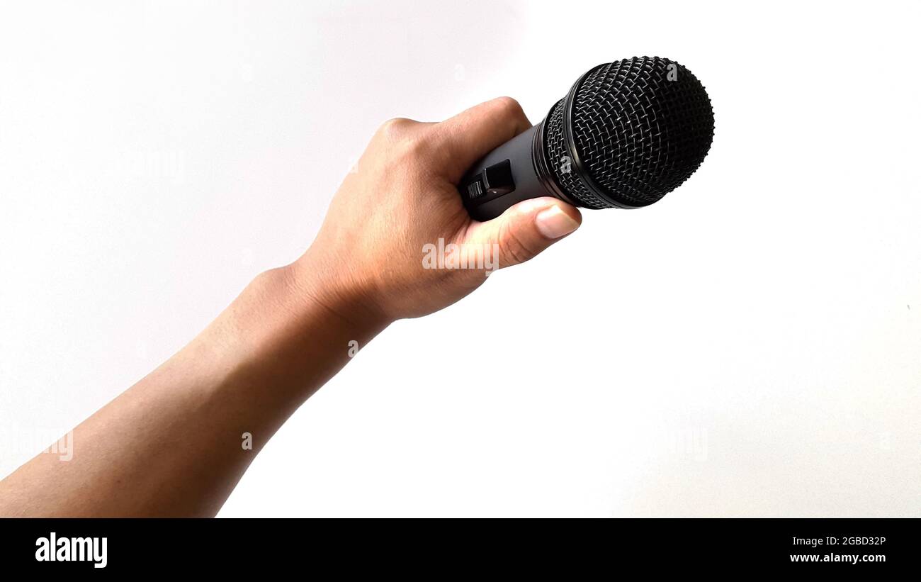Microphone on hand isolated Stock Photo - Alamy