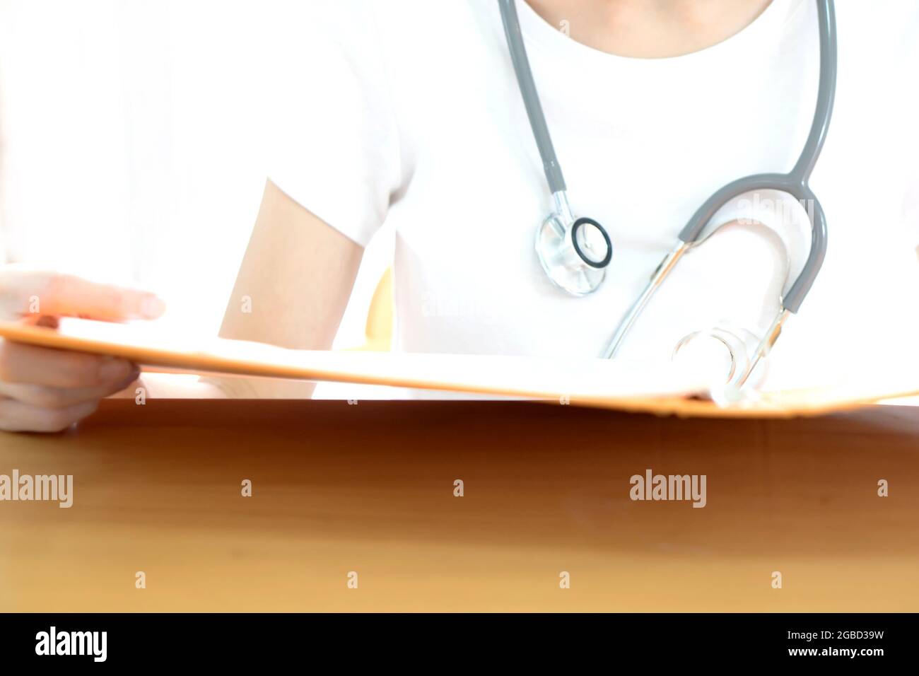 Female medical doctor reading Stock Photo - Alamy