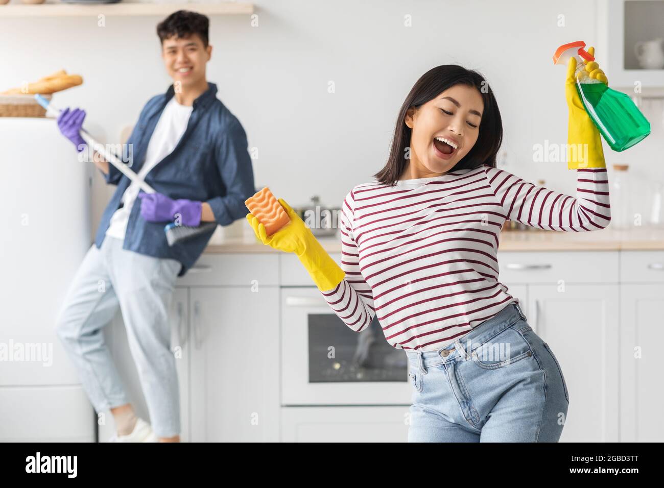 Funny asian woman singing songs and dancing Stock Photo - Alamy