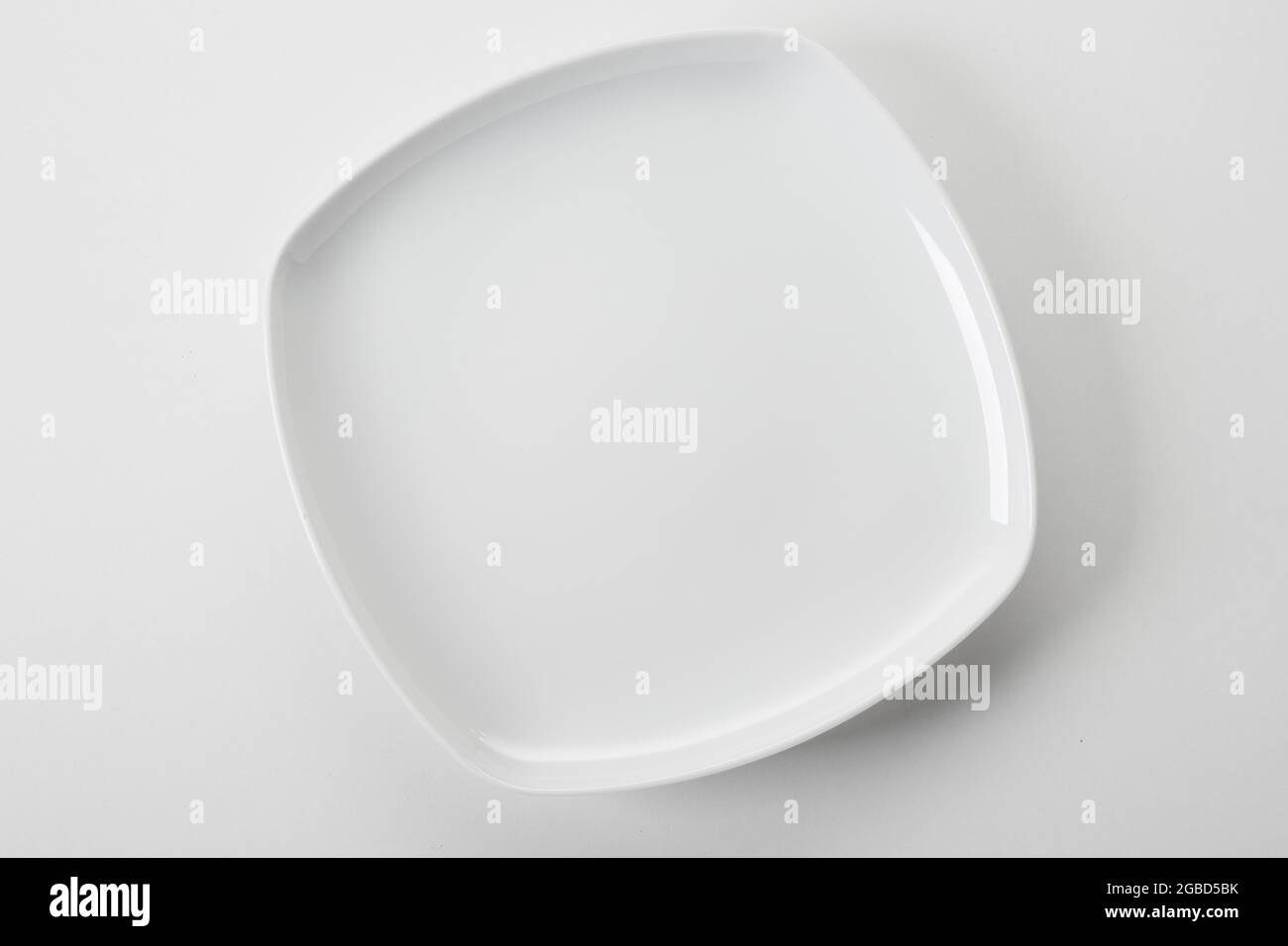 Top view of minimalist style empty clean white square shaped ceramic ...