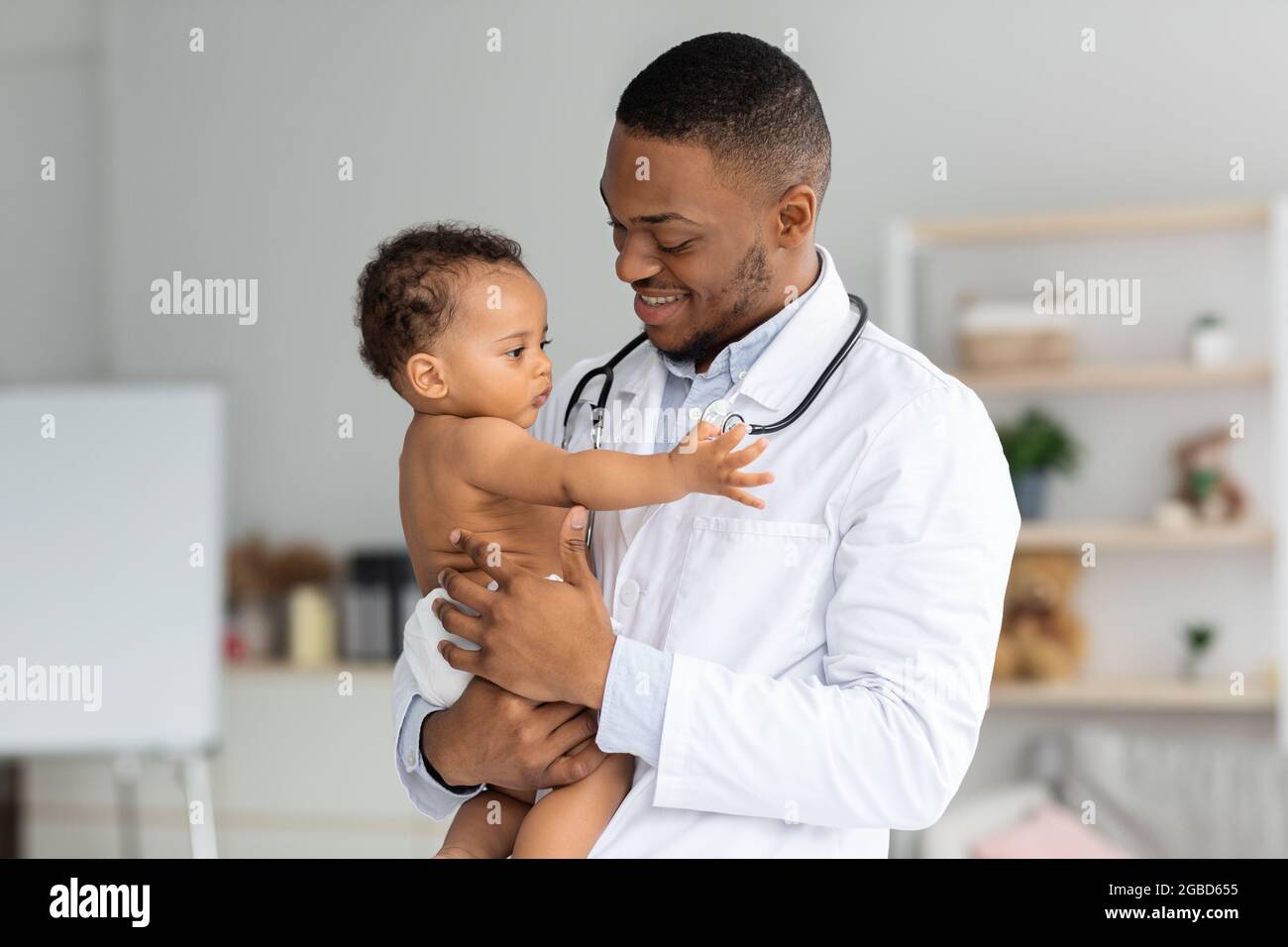 Doctor holding newborn hi-res stock photography and images - Alamy