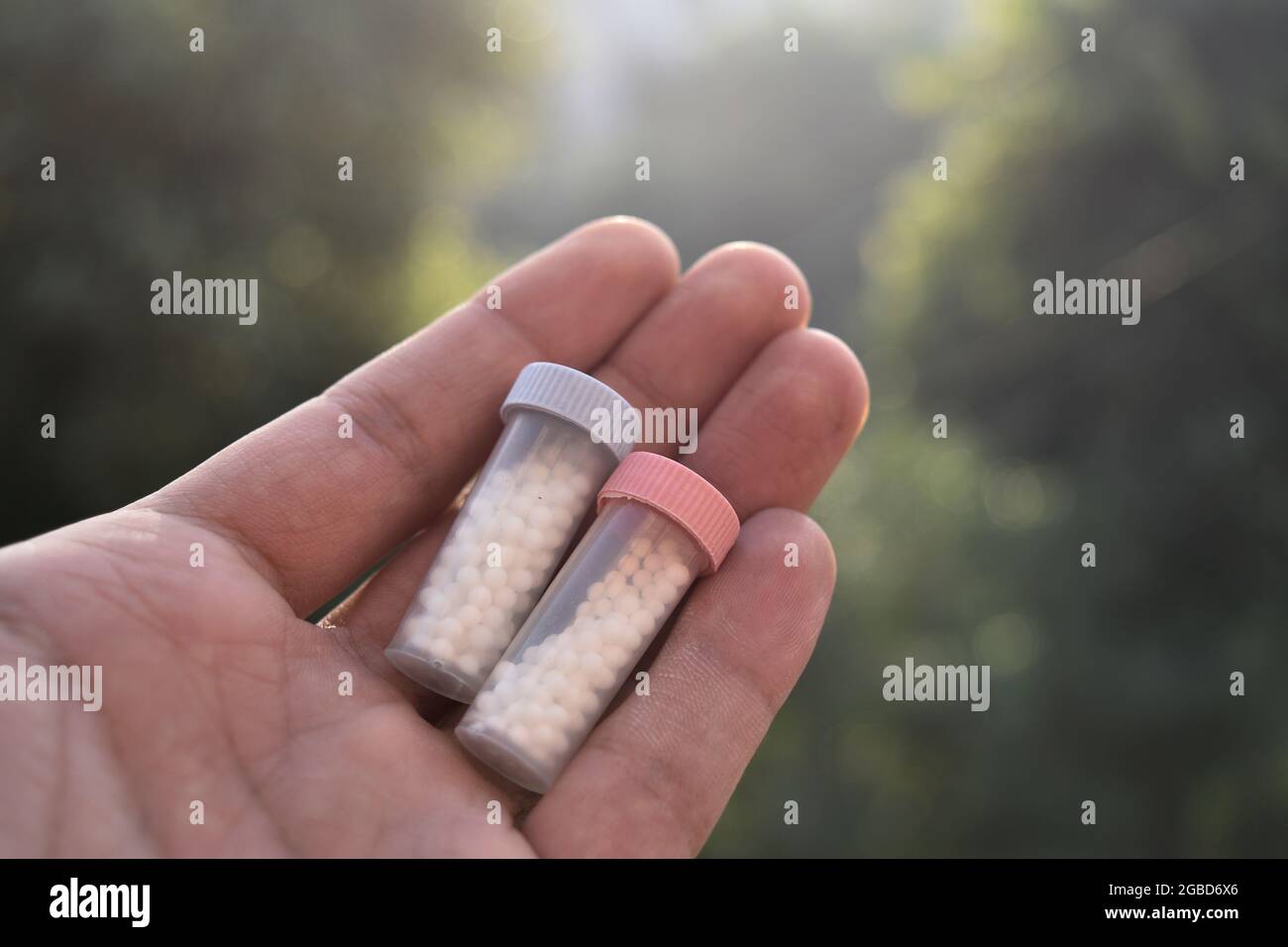 homeopathy medicine in container Stock Photo - Alamy