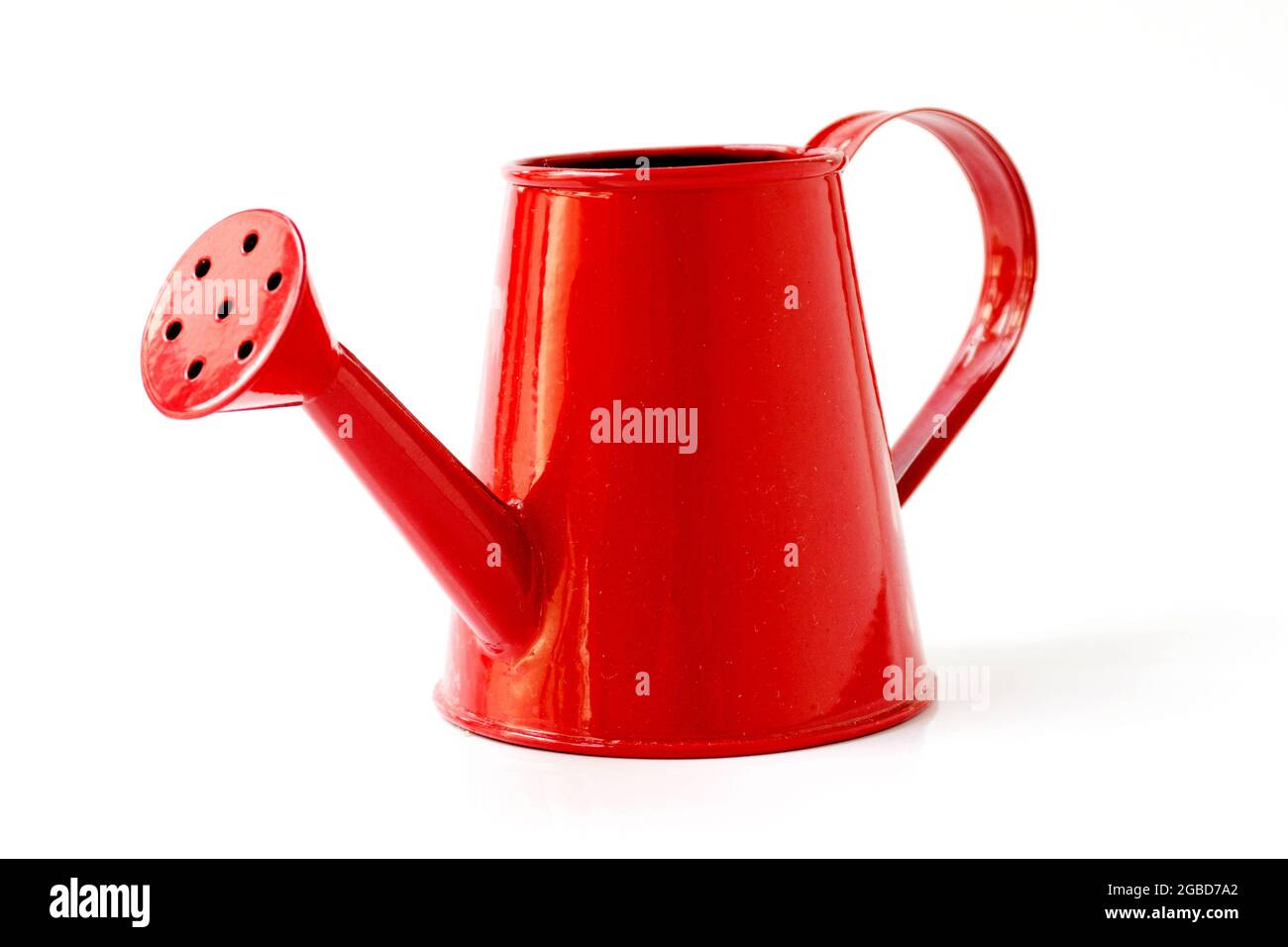 Red Metal Watering Can Stock Photo - Alamy
