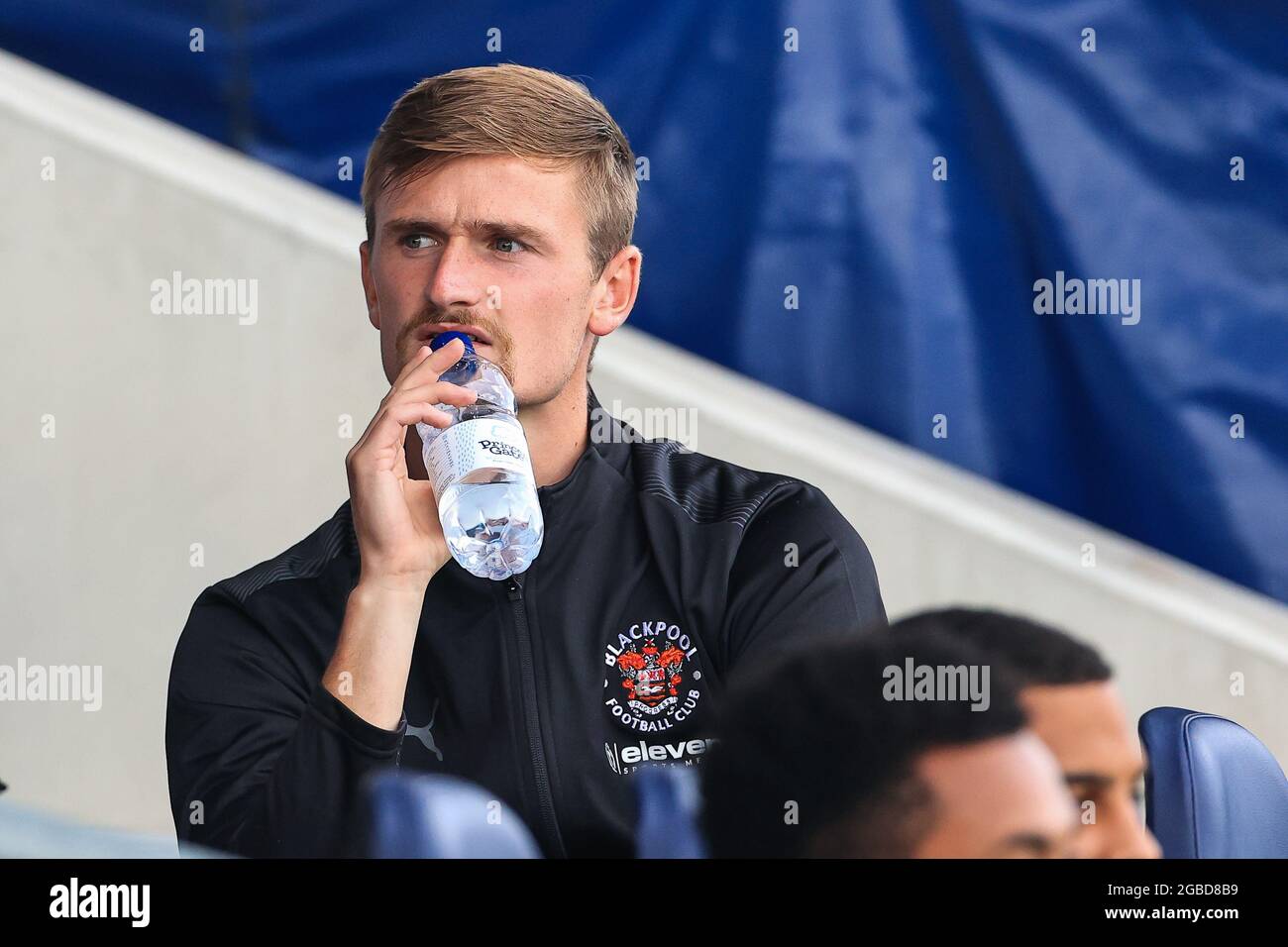Callum Connolly of Blackpool sitting on the bench ahead of tonights ...