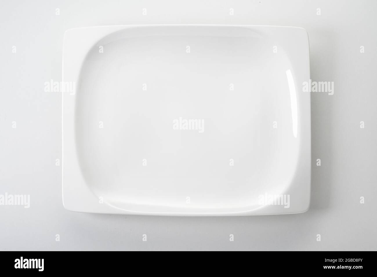 Top view of empty clean rectangular white ceramic plate for serving ...