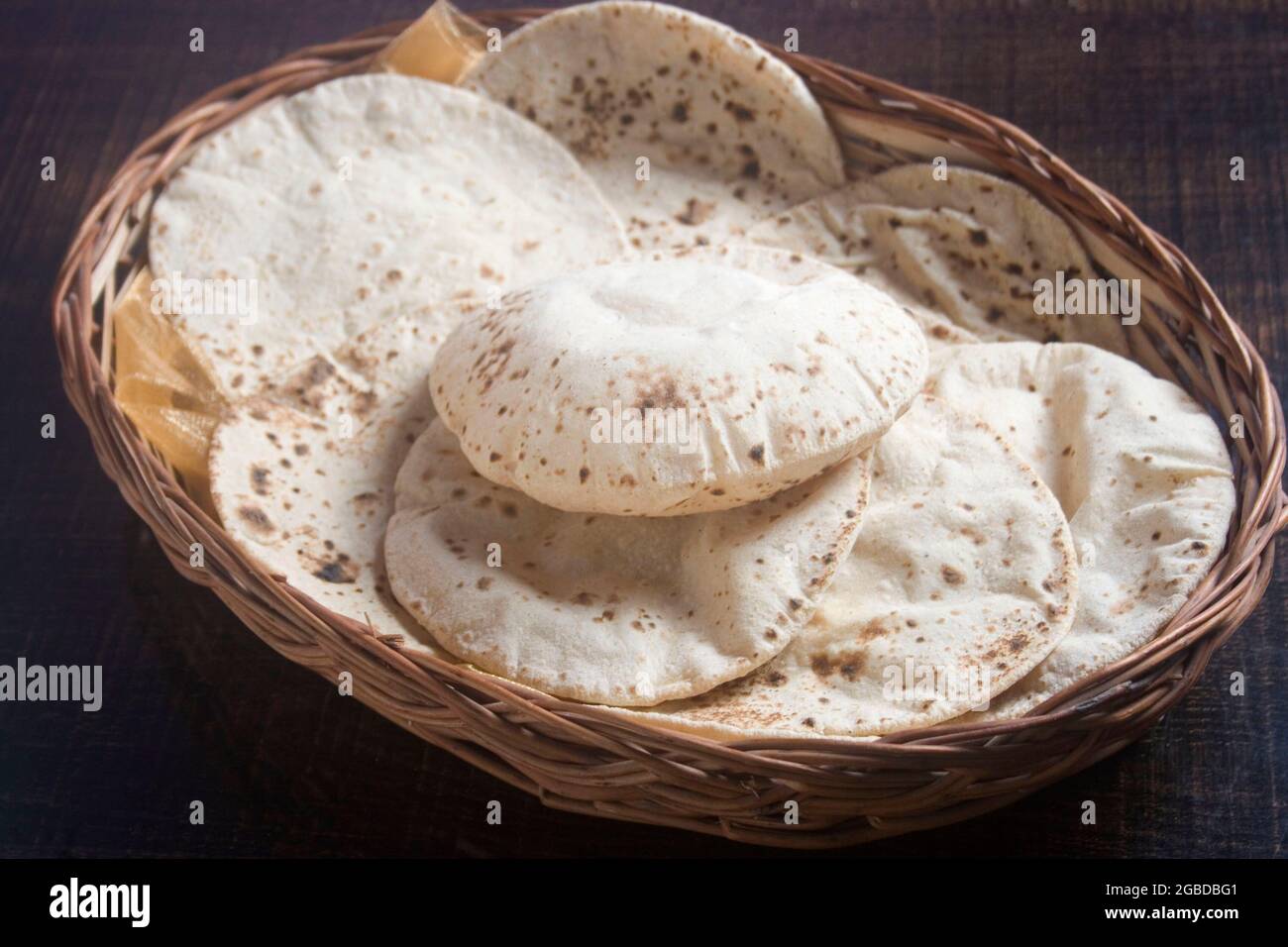 Indian bread roti.Homemade Roti Chapati Flatbread on a rustic wooden ...