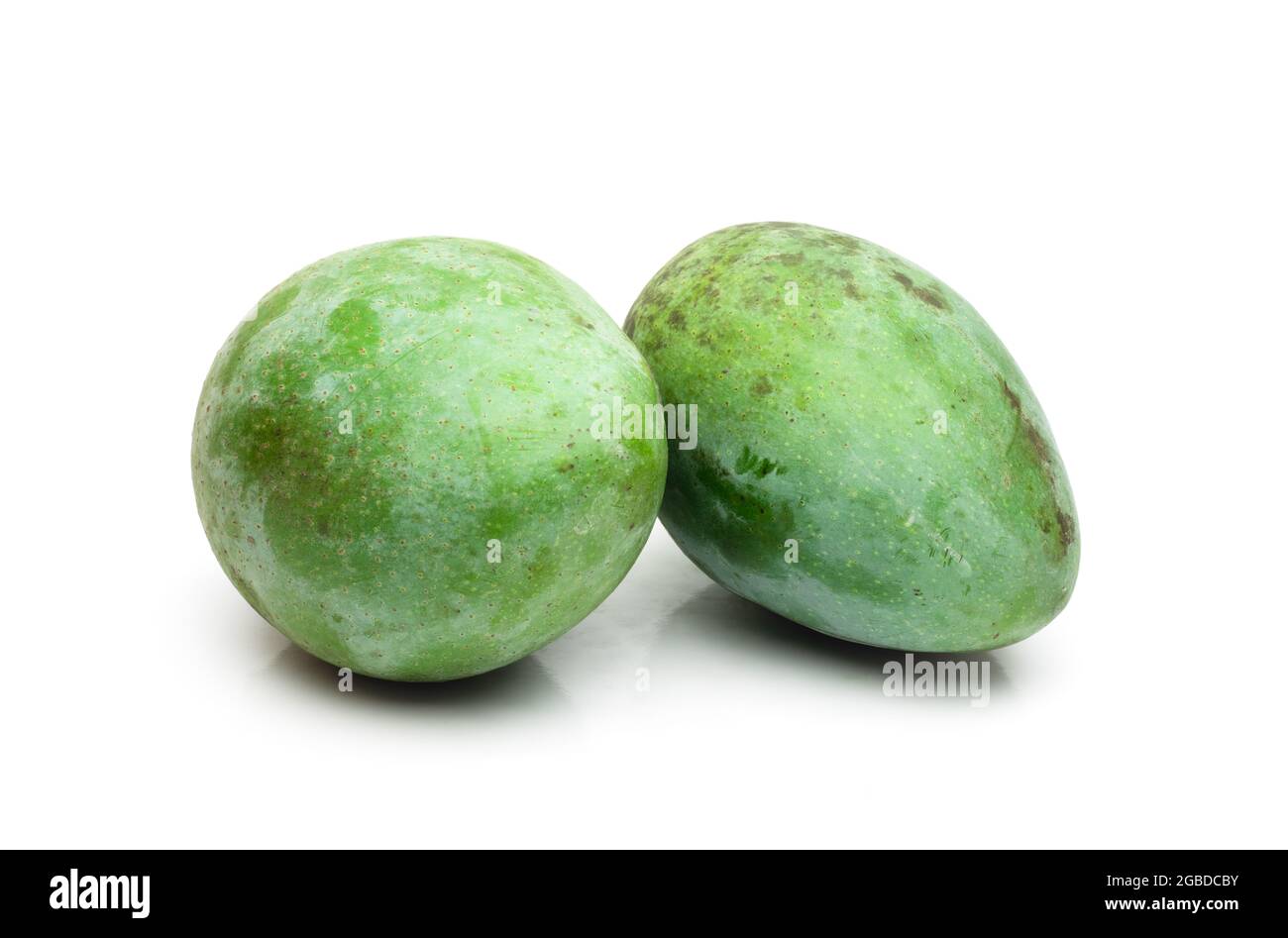 Organic fresh raw mango fruit close up on isolated white background ...