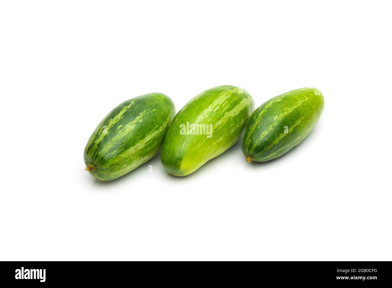 Three green raw pointed gourd potol vegetable on isolated white ...