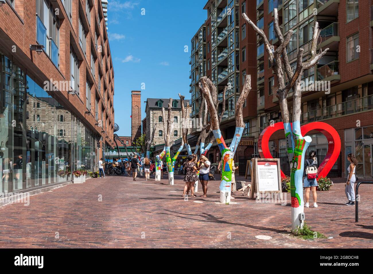 Entrance to the Distillery District decorated with art in the tree ...