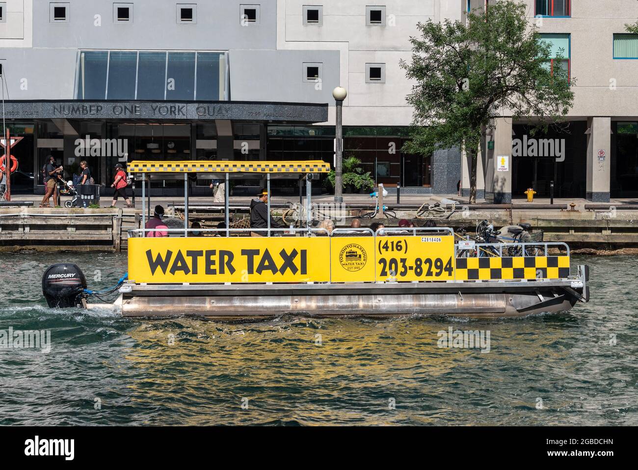 Water Taxi leaving waterfront in the downtown district in Toronto ...