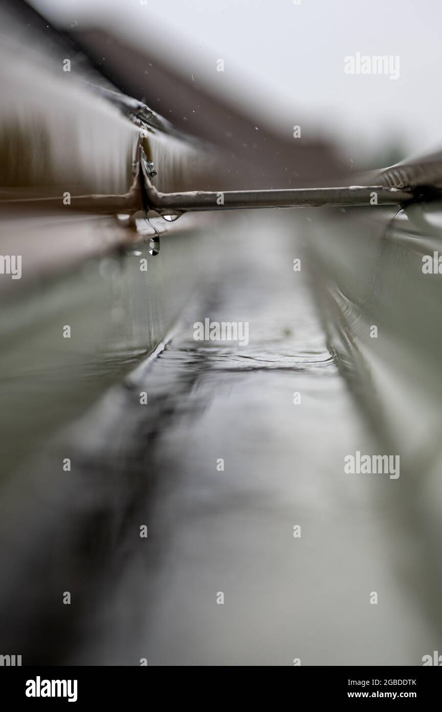 Selective focus on a section of residential guttering with hanger ...