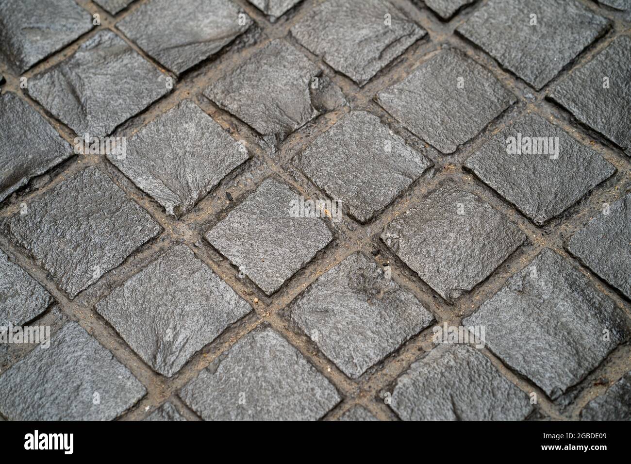 Old paving concrete with square patterns on the street Stock Photo - Alamy