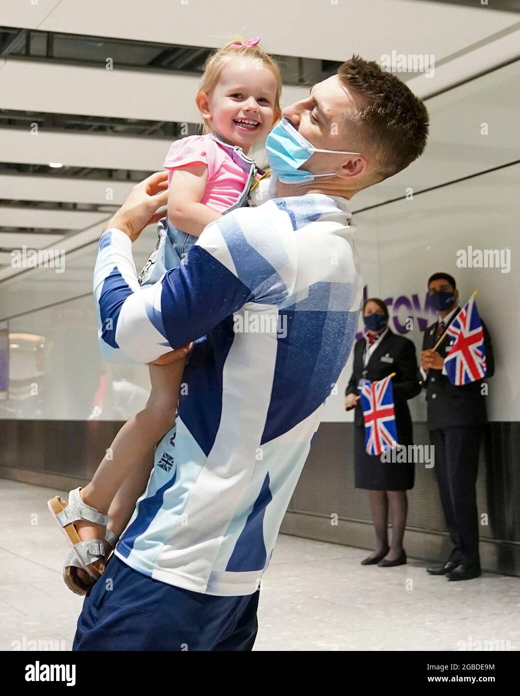 Olympic gymnast Max Whitlock hugs his daughter Willow as he arrives ...