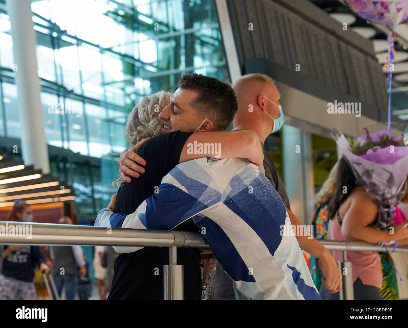 Olympic gymnast Max Whitlock hugs his family as he arrives back at ...