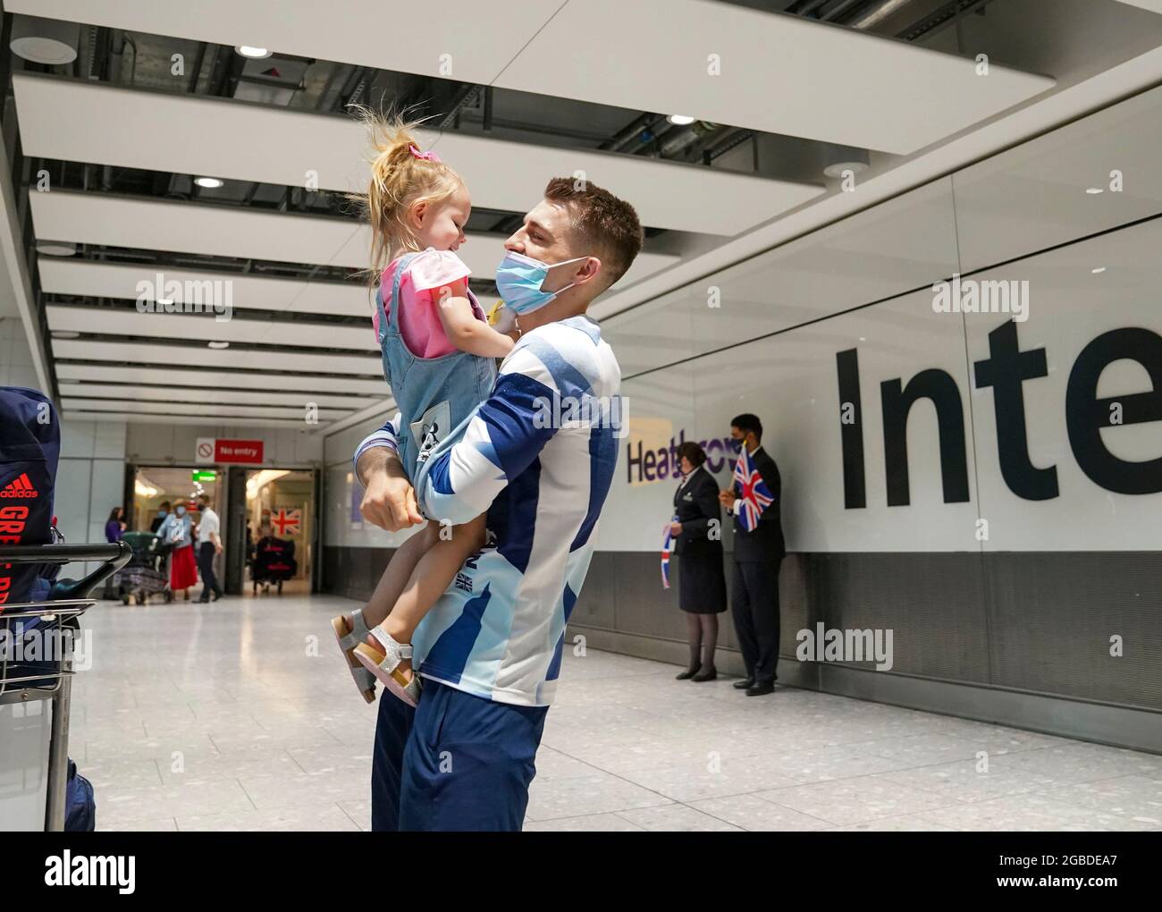 Olympic gymnast Max Whitlock hugs his daughter Willow as he arrives ...