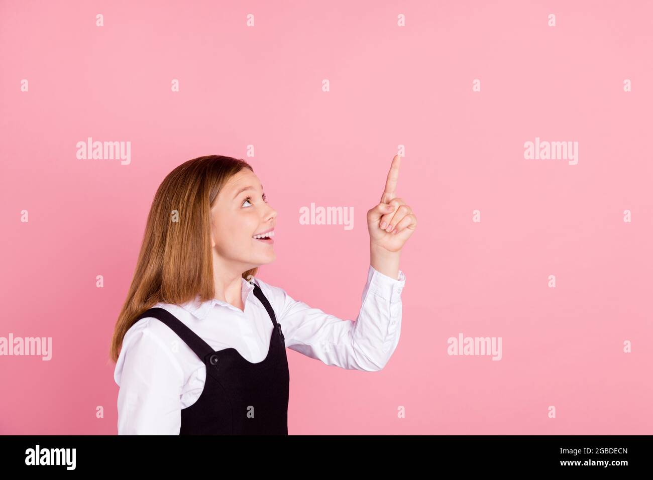 Photo of pretty excited school girl wear white black uniform smiling ...