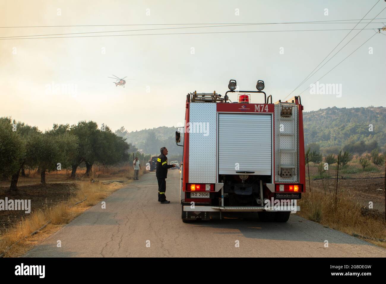 Heatwave causes fires burning for a second day the isle of Rodos ...