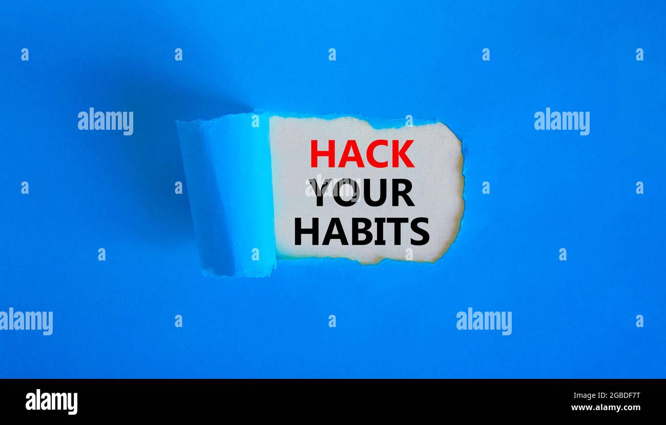 Hack your habits symbol. Words 'Hack your habits' appearing behind torn ...
