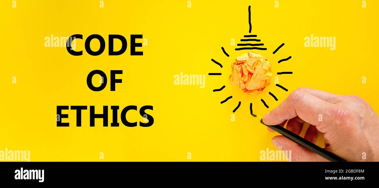 Code of conduct symbol. Businessman writing words 'Code of ethics ...