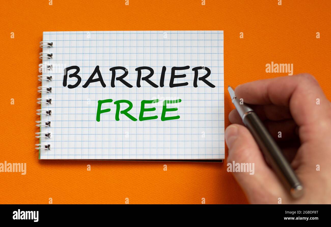 Barrier free symbol. Businessman writing words 'Barrier free' on white ...