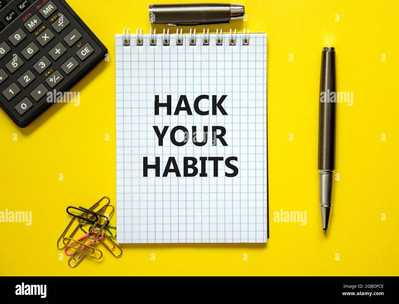 Hack your habits symbol. Words 'Hack your habits' on white note. Yellow ...