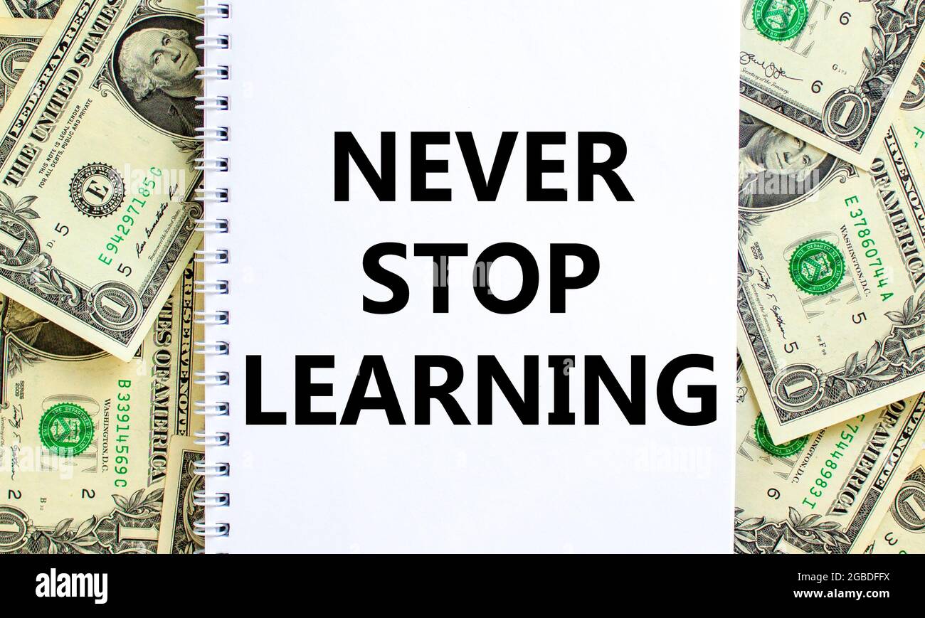 Never stop learning symbol. Words 'Never stop learning' on white note ...