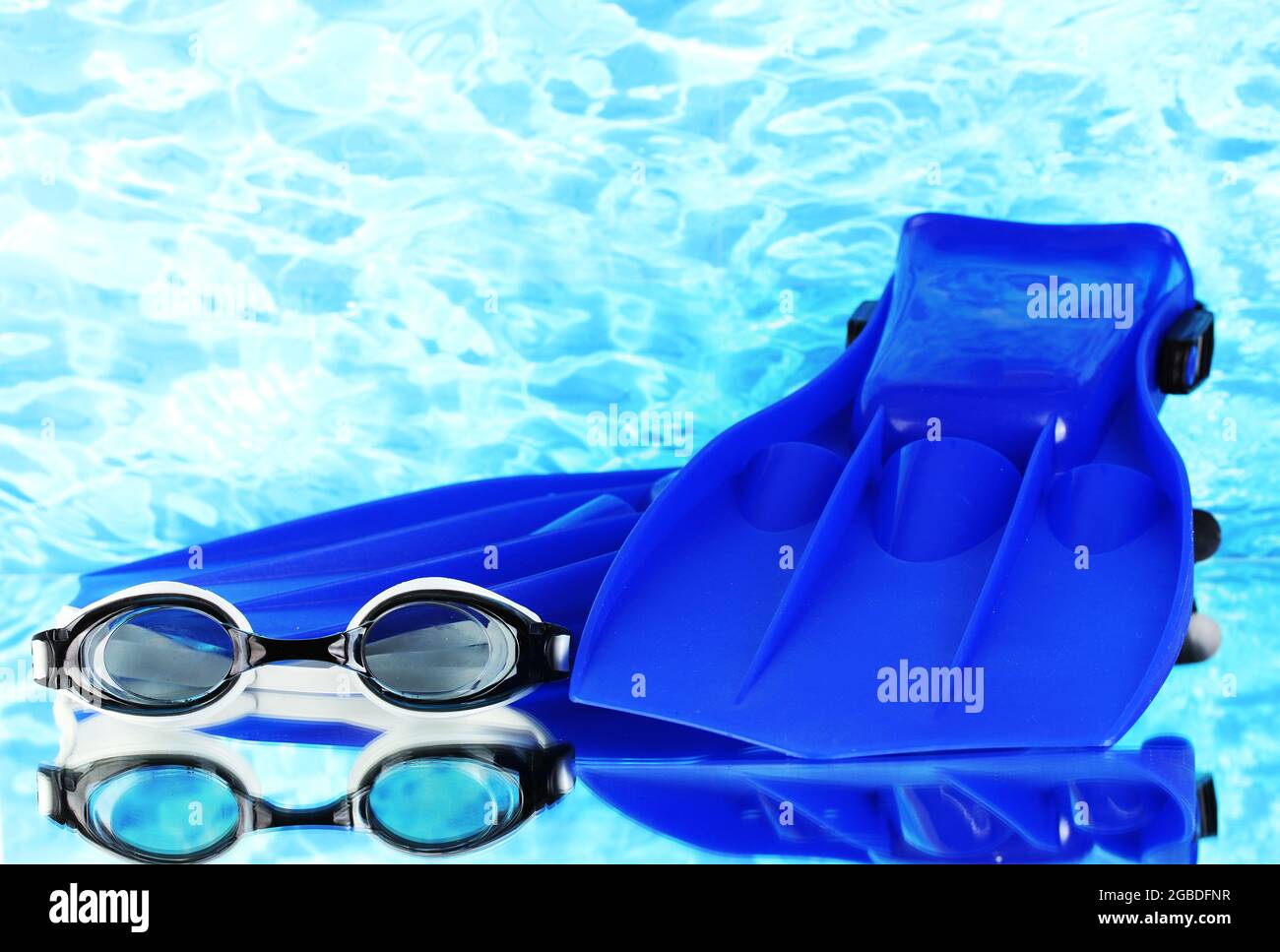 blue flippers and goggles on blue sea background Stock Photo - Alamy