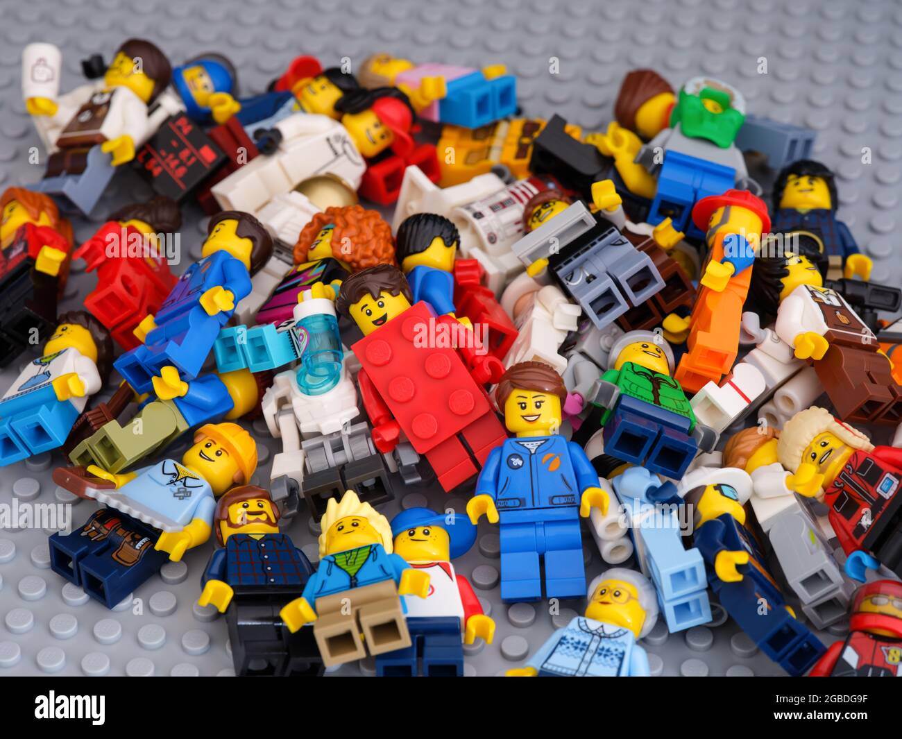 Tambov, Russian Federation - July 16, 2021 Many Lego minifigures lying ...