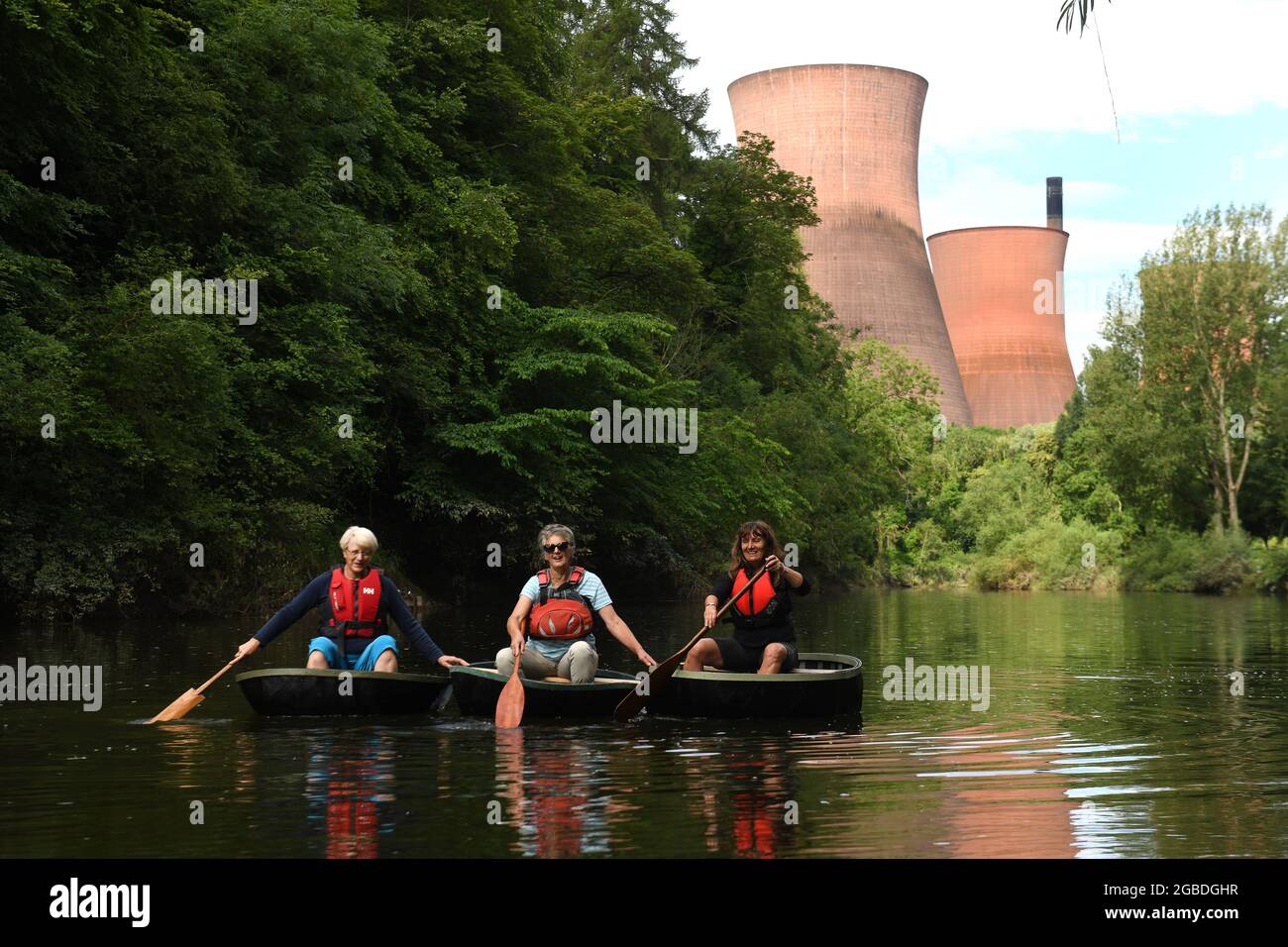 Members of the Ironbridge Coracle Society with their coracles on the River Severn in Ironbridge ...