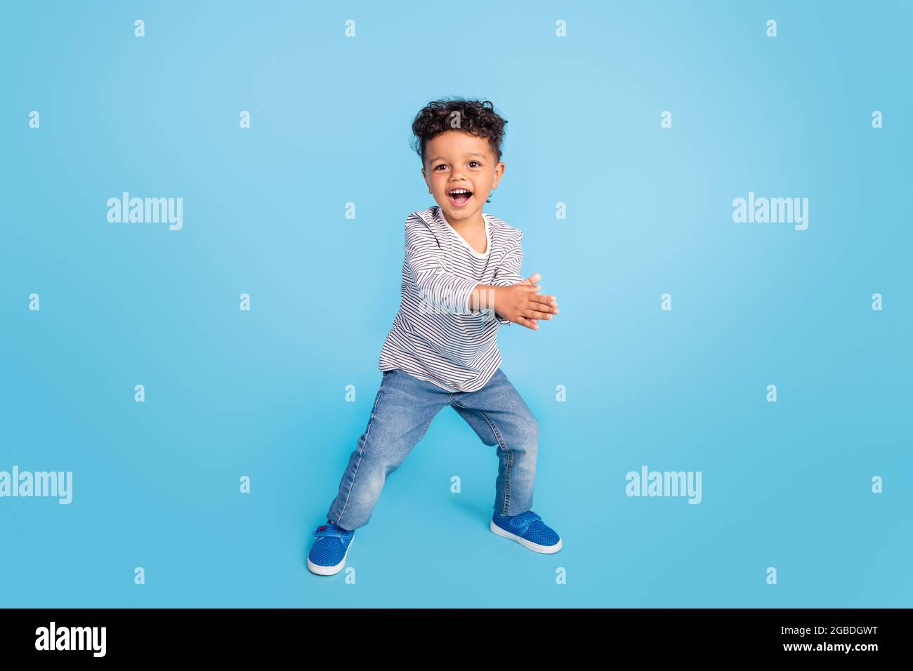 Full length body size view of attractive cheerful boy dancing clapping ...