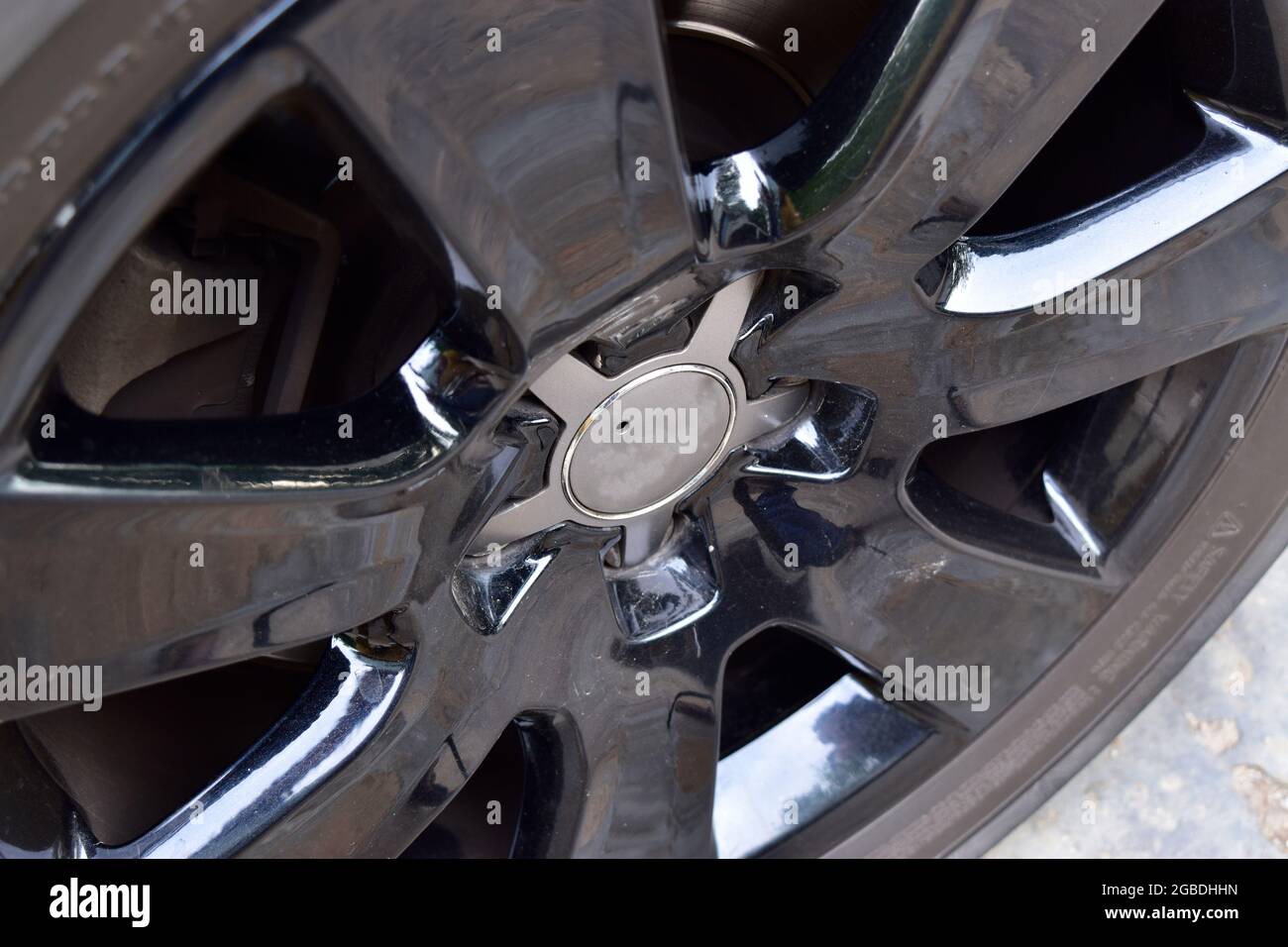 closeup of black shiny alloy wheel , automobile concept Stock Photo - Alamy