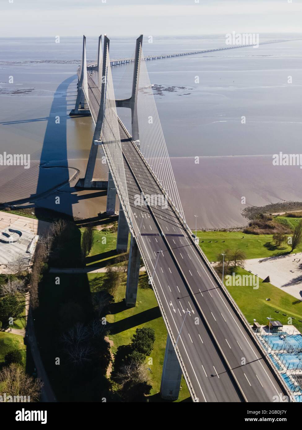 Aerial shot of Vasco da Gama bridge crossing Tagus river and an ...