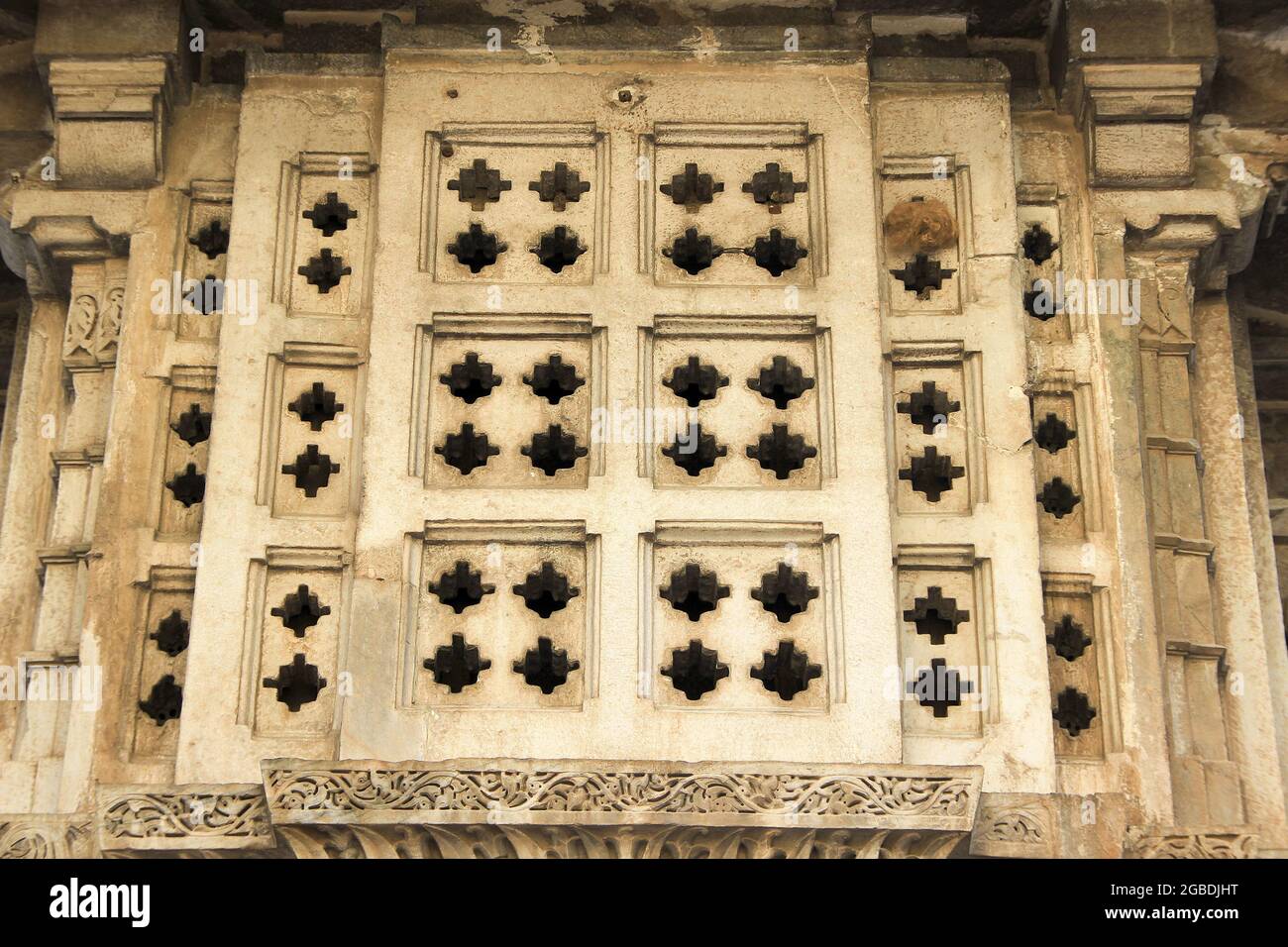 Recessed stone window panels in stepped layers on wall of Jagadeesh ...