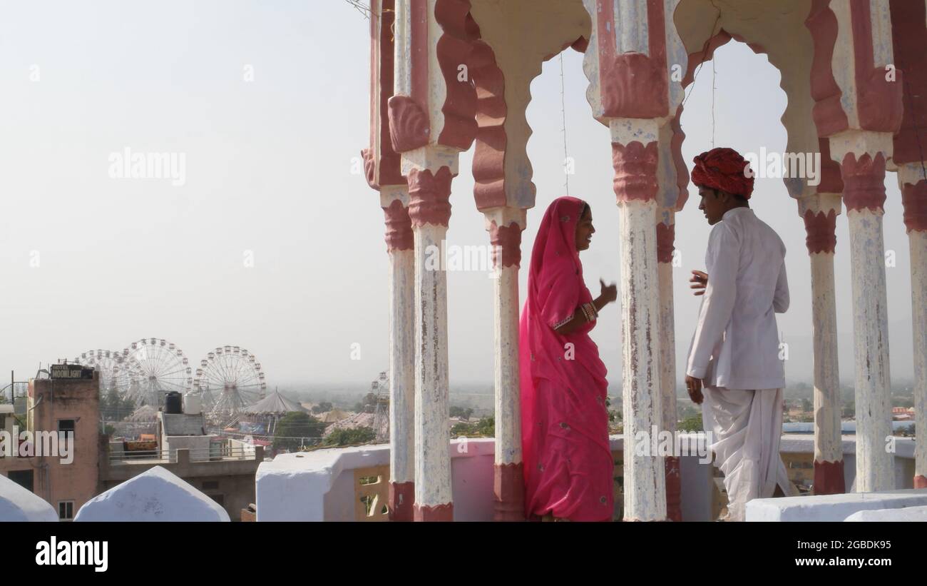 Indian couple in traditional clothes talking to each other Stock Photo ...