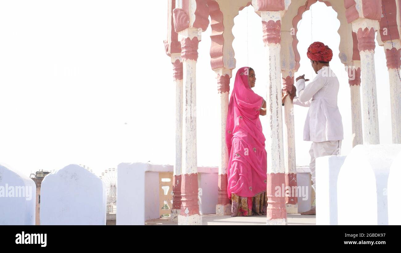 Indian couple in traditional clothes talking to each other Stock Photo ...