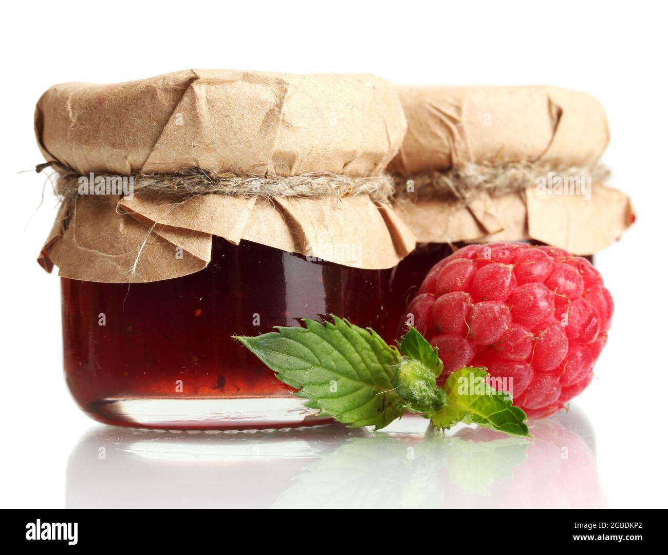 jars with jam and ripe raspberry with mint isolated on white Stock ...