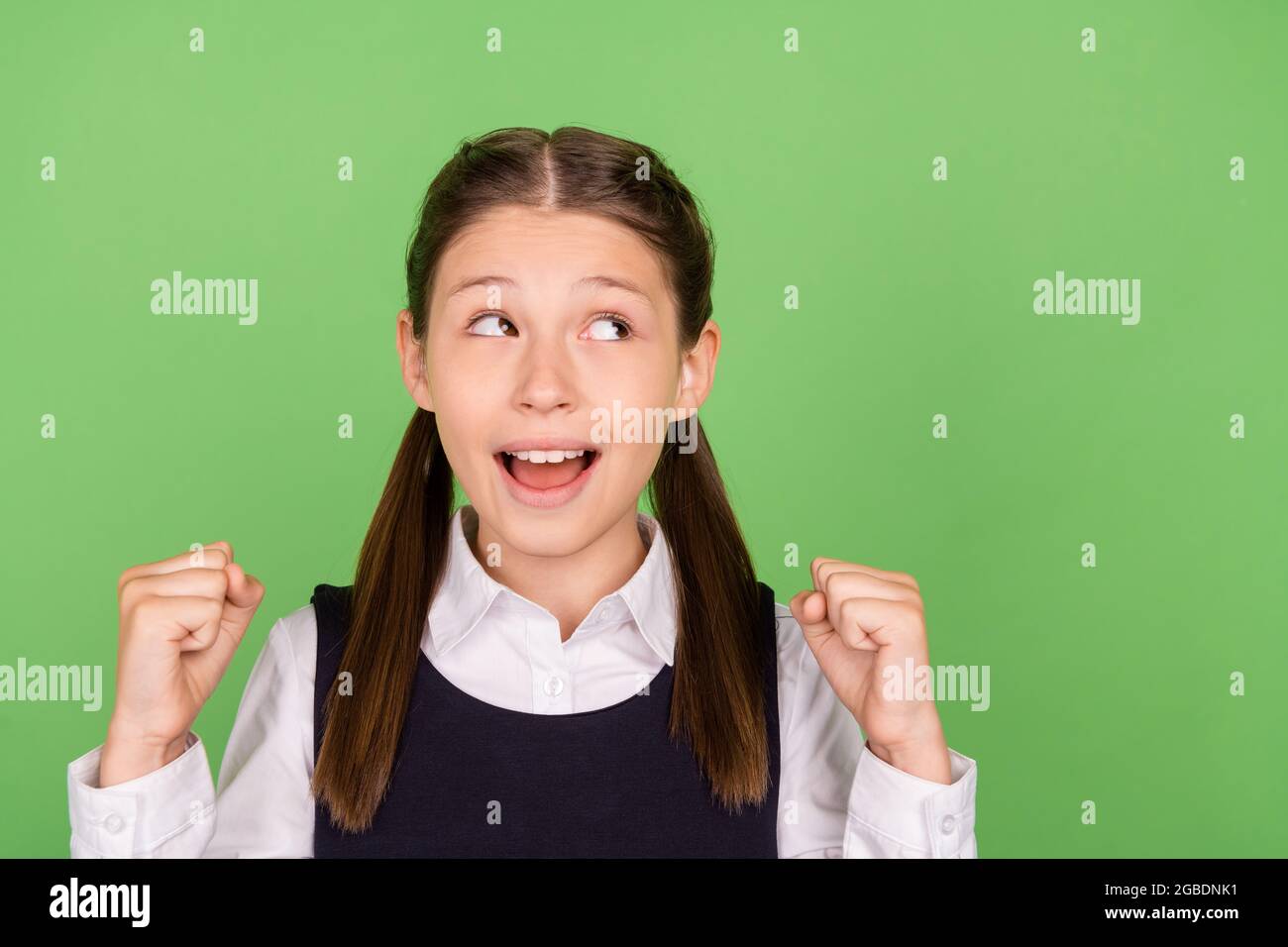 Photo portrait little girl smiling gesturing like winner looking ...