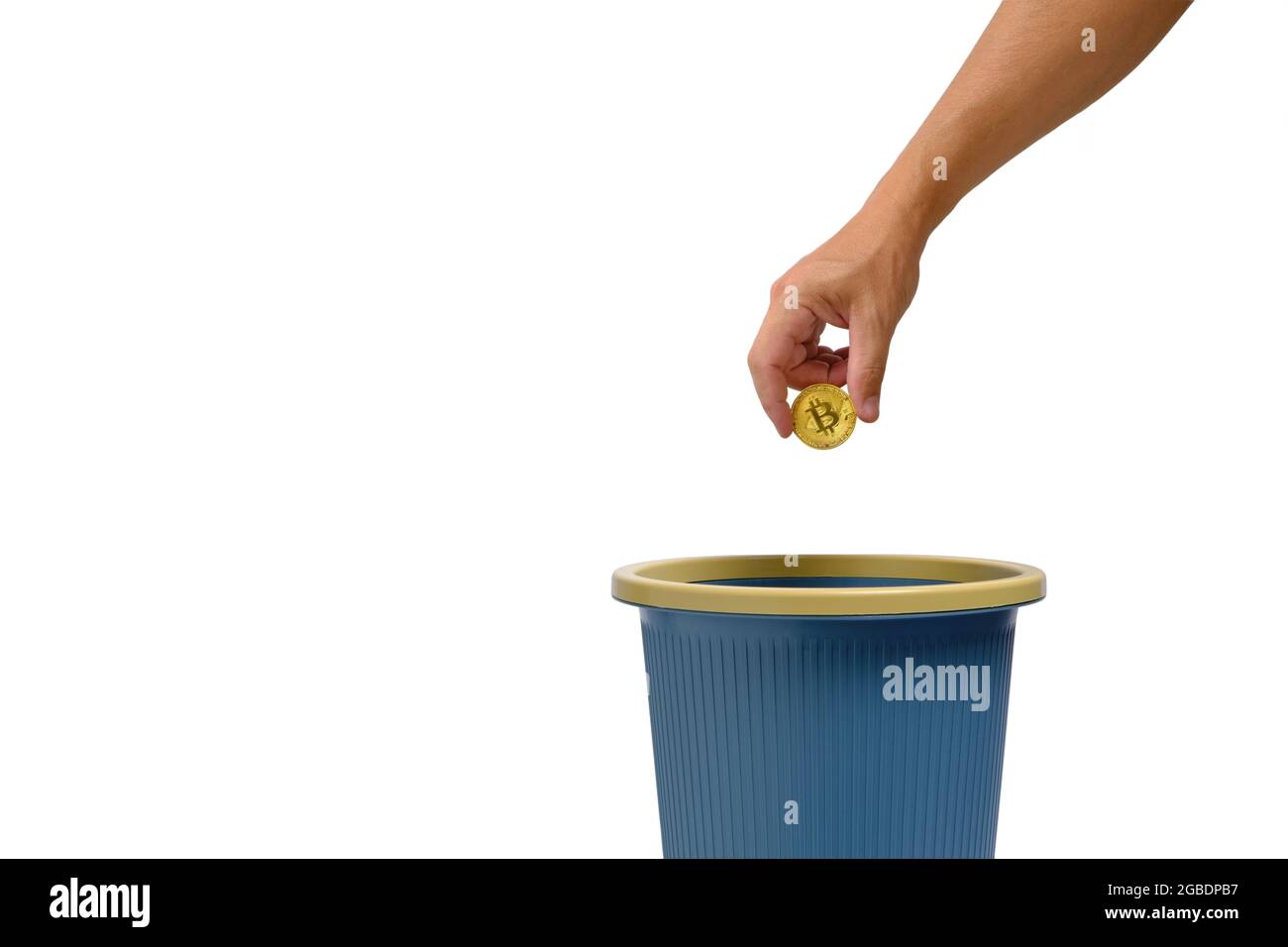 Bitcoin coin in hand on white background is thrown into trash. Concept ...