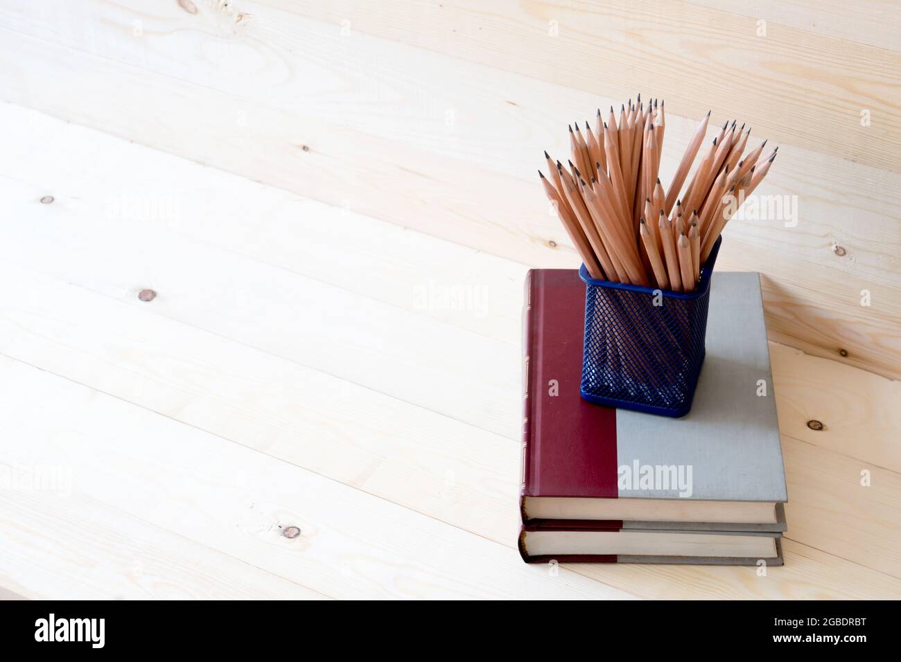 Education concept, pencil for work on a wood table Stock Photo - Alamy