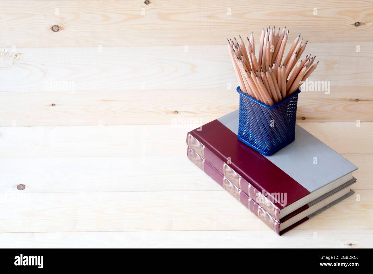 Education concept, pencil for work on a wood table Stock Photo - Alamy