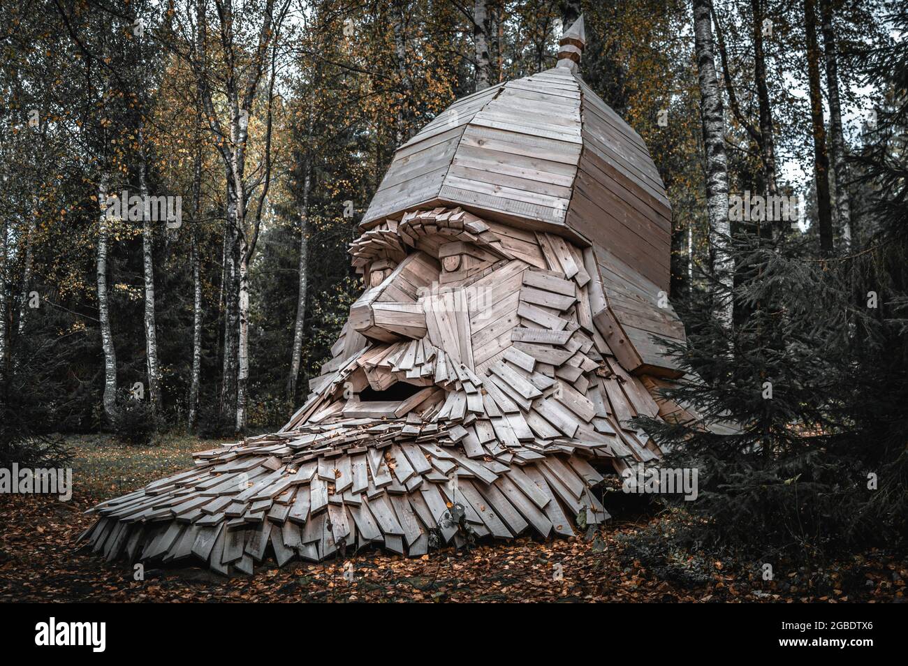 Head of a giant warrior made of wooden planks. Mandrogi Village, Russia ...