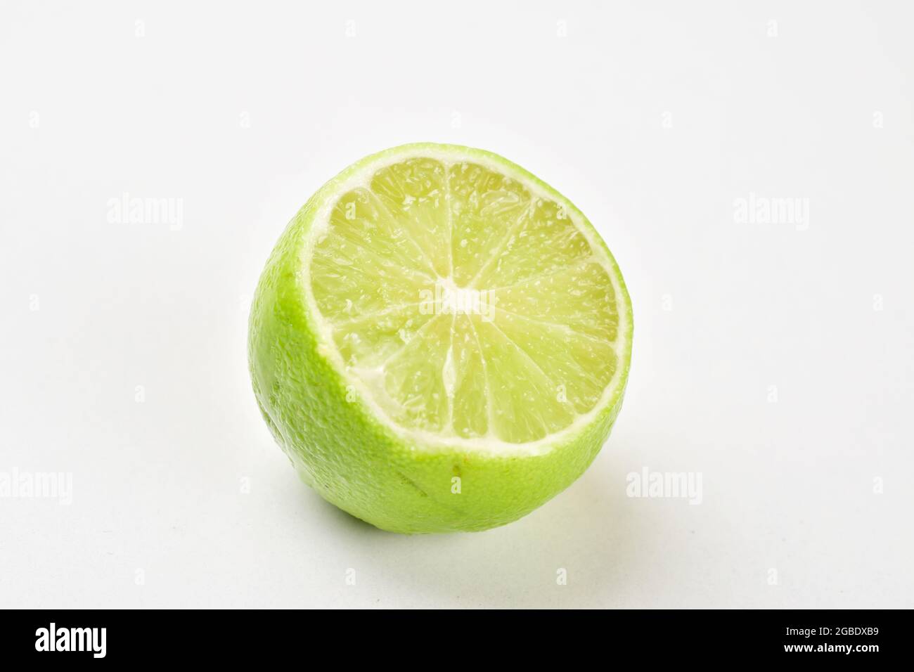 Half Cut Lime Isolated On White Background With Clipping Path Stock ...