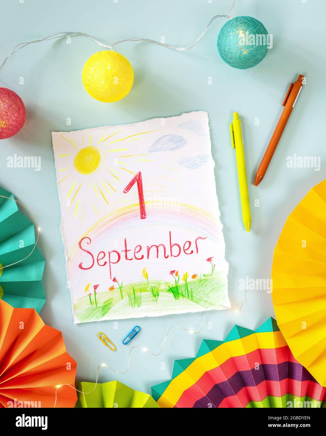 Holiday, school composition with white sheet with a child's drawing and ...