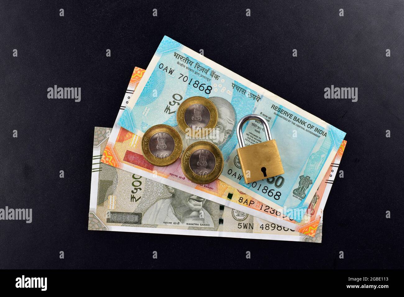 Lock with Indian Currency note on Dark Background Stock Photo - Alamy