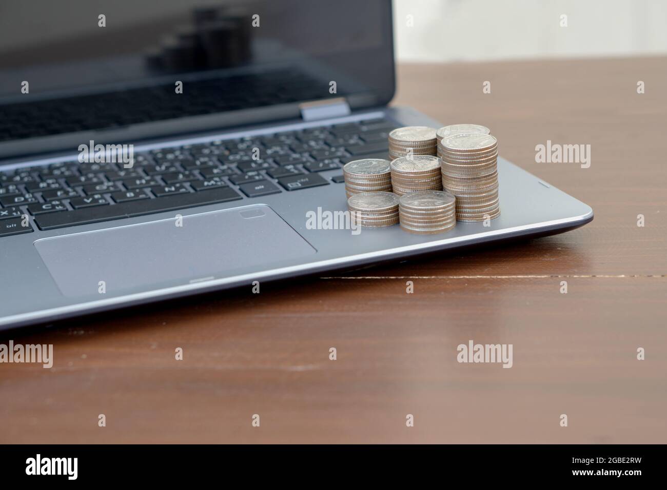 Money and laptop Stock Photo - Alamy