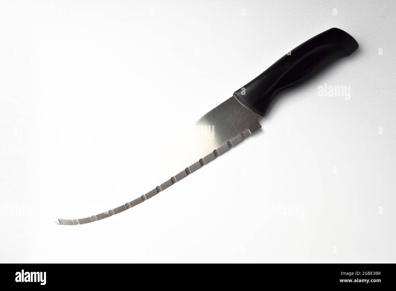 Very sharp serrated chrome metal knife with plastic handle, isolated on ...