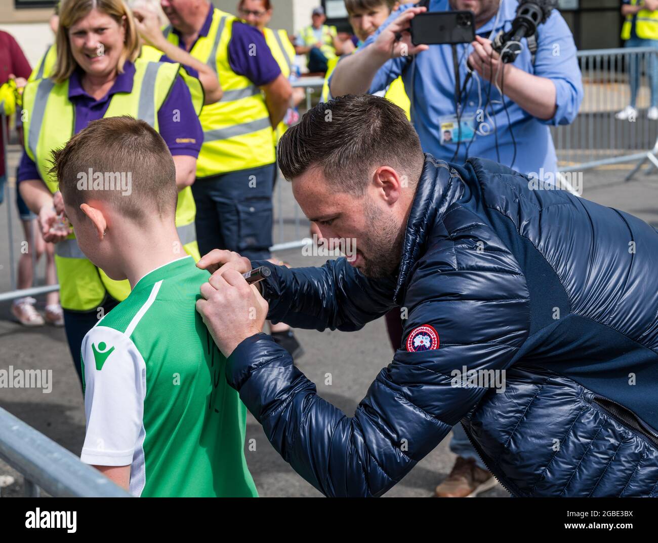 World boxing champion, Josh Taylor, signs autographs at victory bus ...