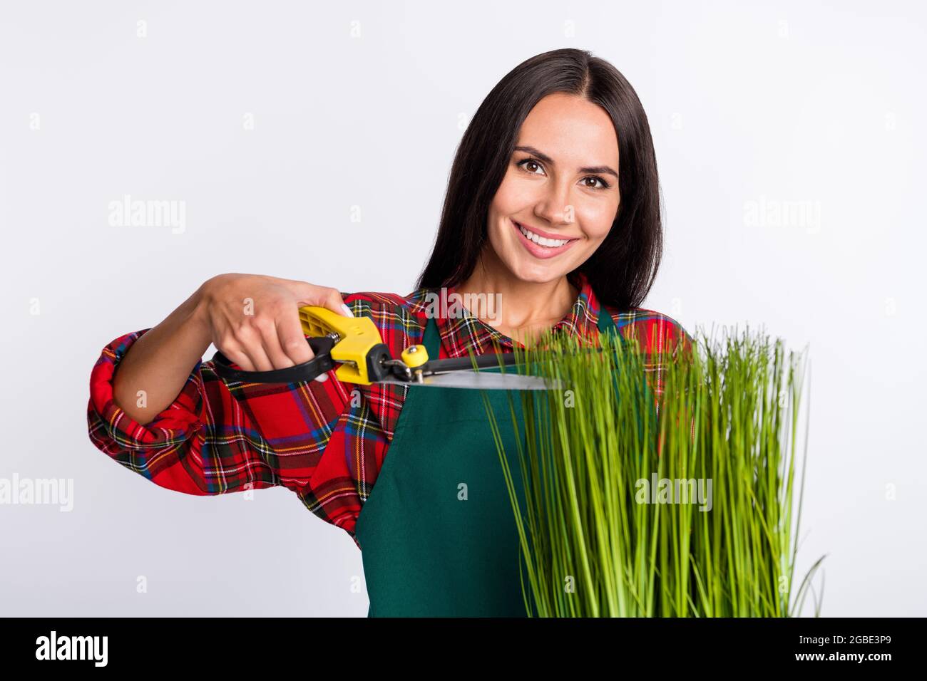 Photo of cheerful beautiful young woman trim grass farmer plant care ...